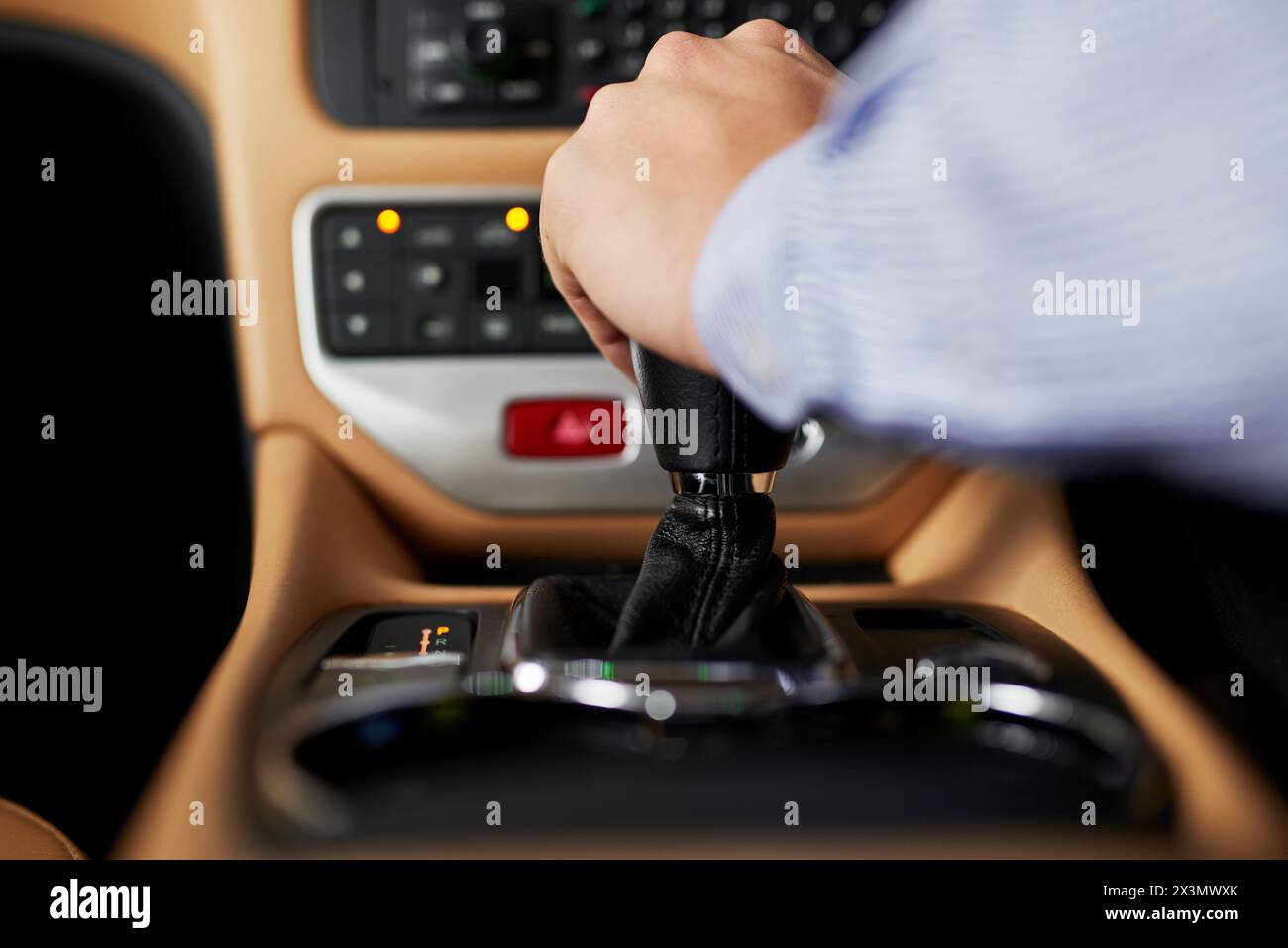 Hands, center console and gear of car for shift, transmission and speed ...