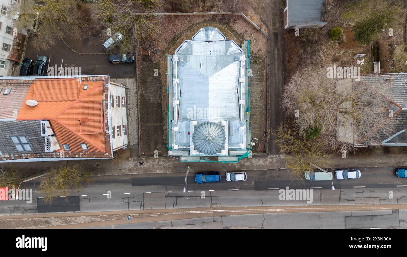 Drone photography of old church being renovated between apartment ...
