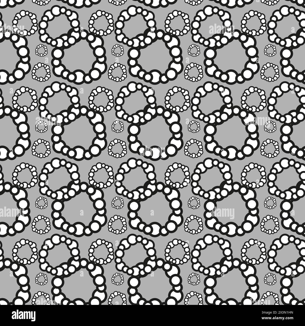 Symmetrical monochrome circles in a seamless pattern on a gray textile ...