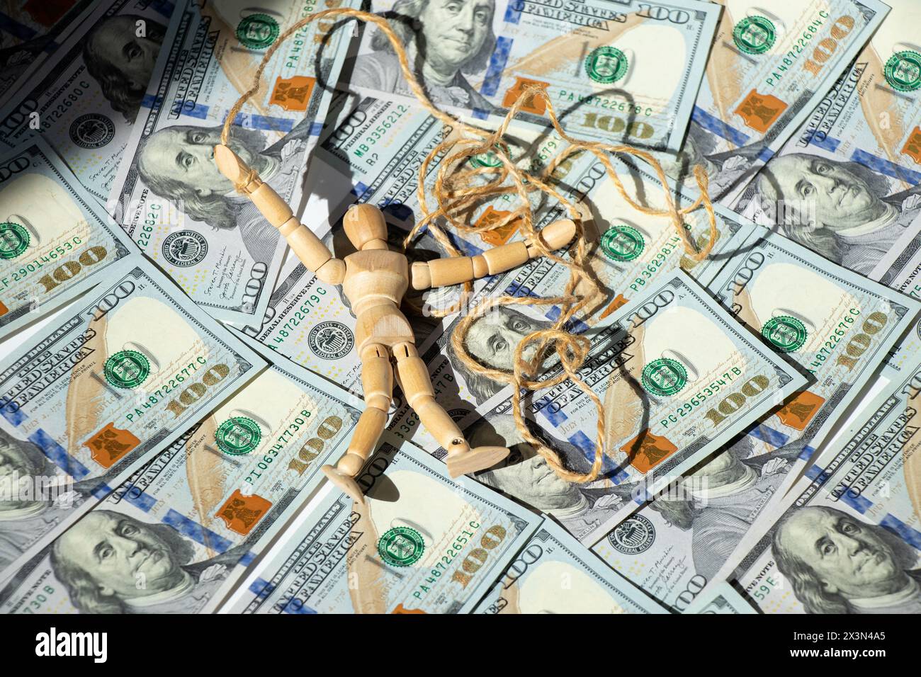 Puppet of a businessman and a dollar bill hi-res stock photography and ...