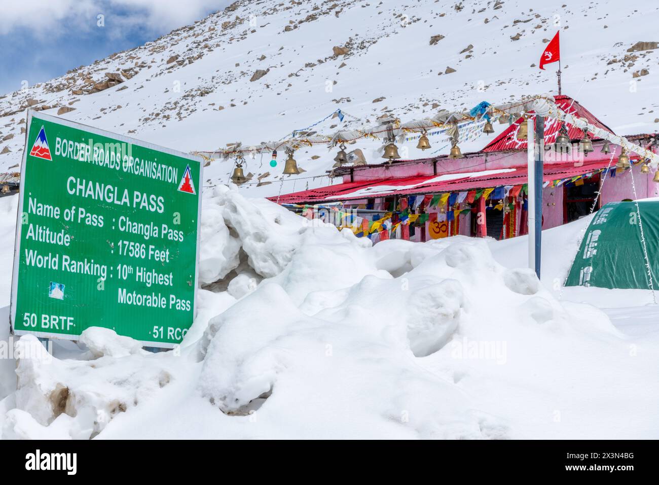 Sign at the summit of the Chang La mountain pass at 17,590 feet in the northern Indian Himalayas ...