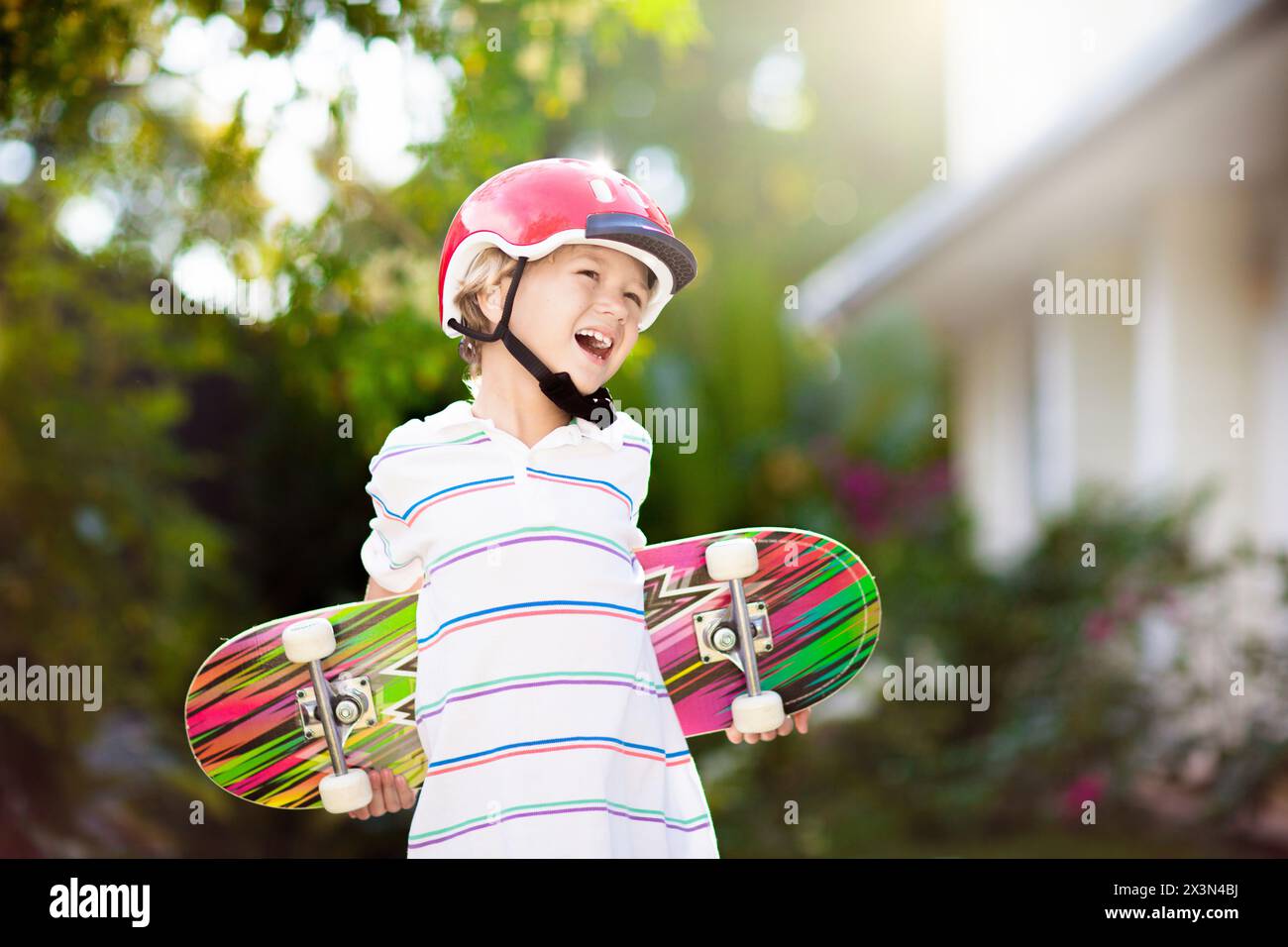 Kid with skateboard. Child riding skate board. Healthy sport and ...