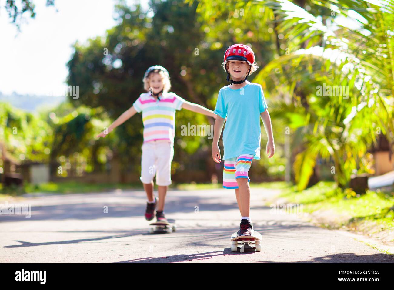 Kid with skateboard. Child riding skate board. Healthy sport and ...
