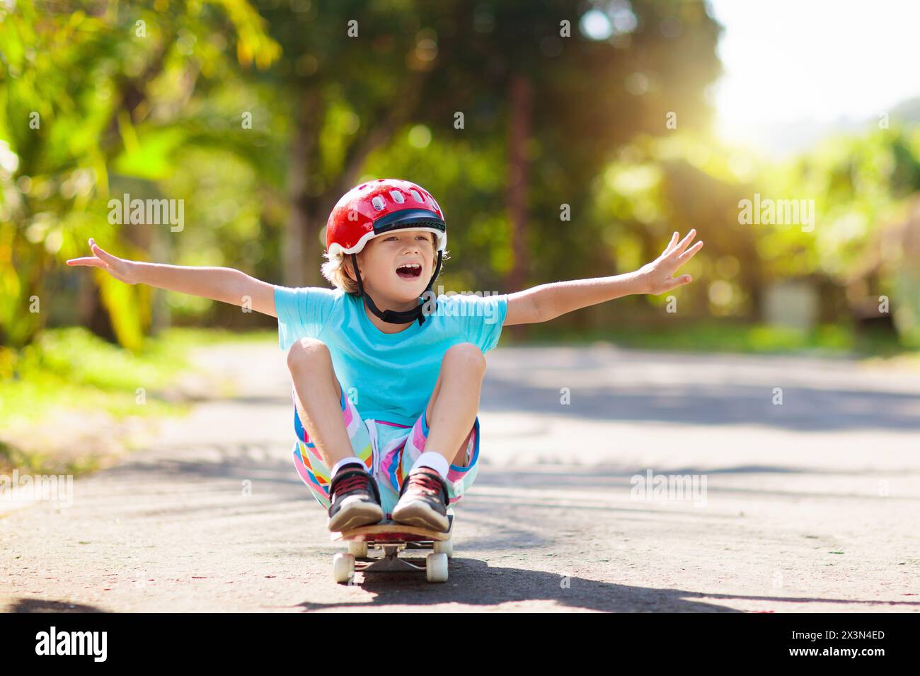 Kid with skateboard. Child riding skate board. Healthy sport and ...
