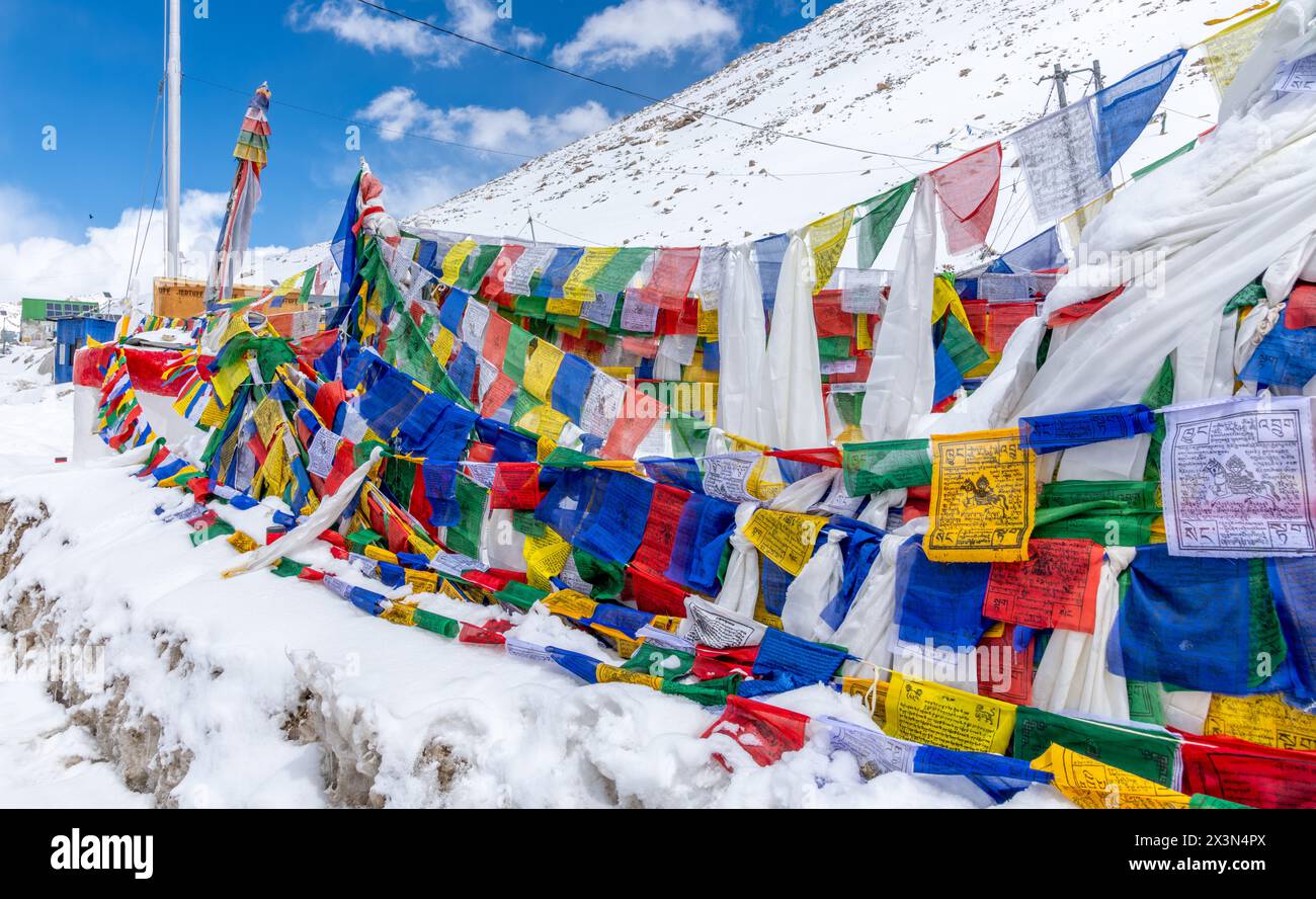 Prayer flags at the summit of the Chang La mountain pass at 17,590 feet ...
