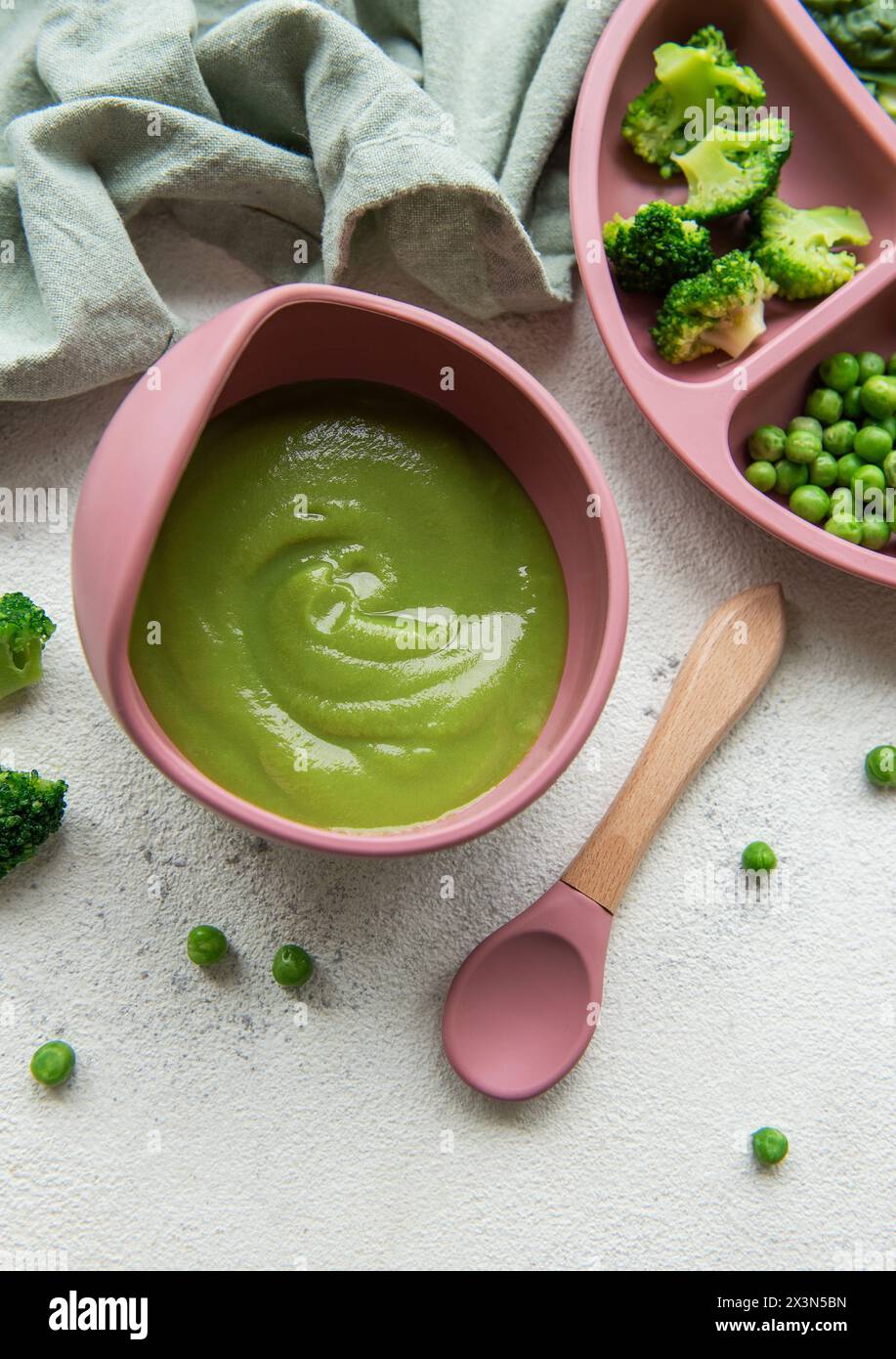 Healthy baby food in bowl. Baby food vegetable puree with broccoli and ...