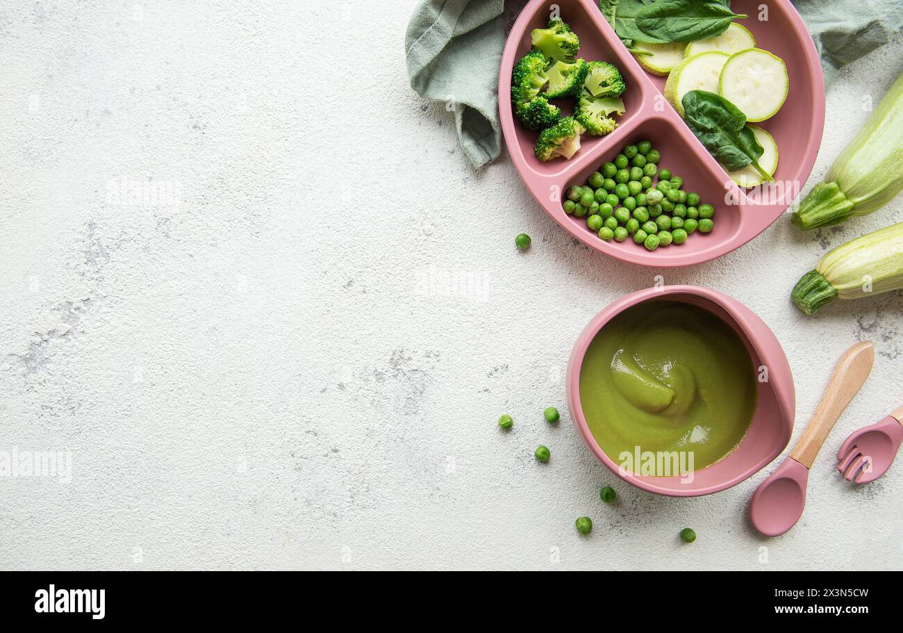 Healthy baby food in bowl. Baby food vegetable puree with broccoli and ...