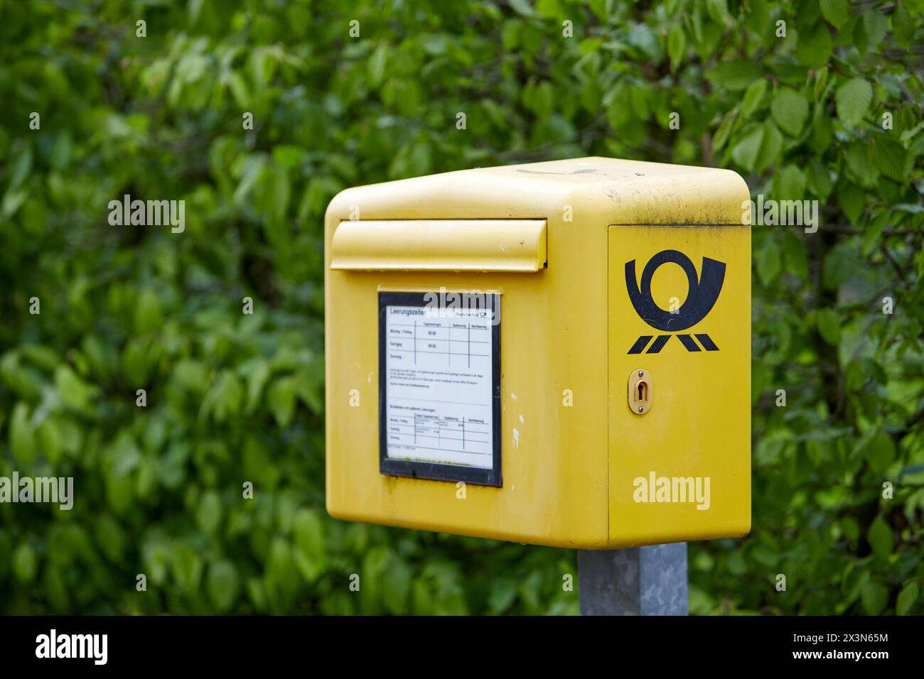 Ense, NRW, Germany, 04 21 2024, german yellow letter box with sign of ...