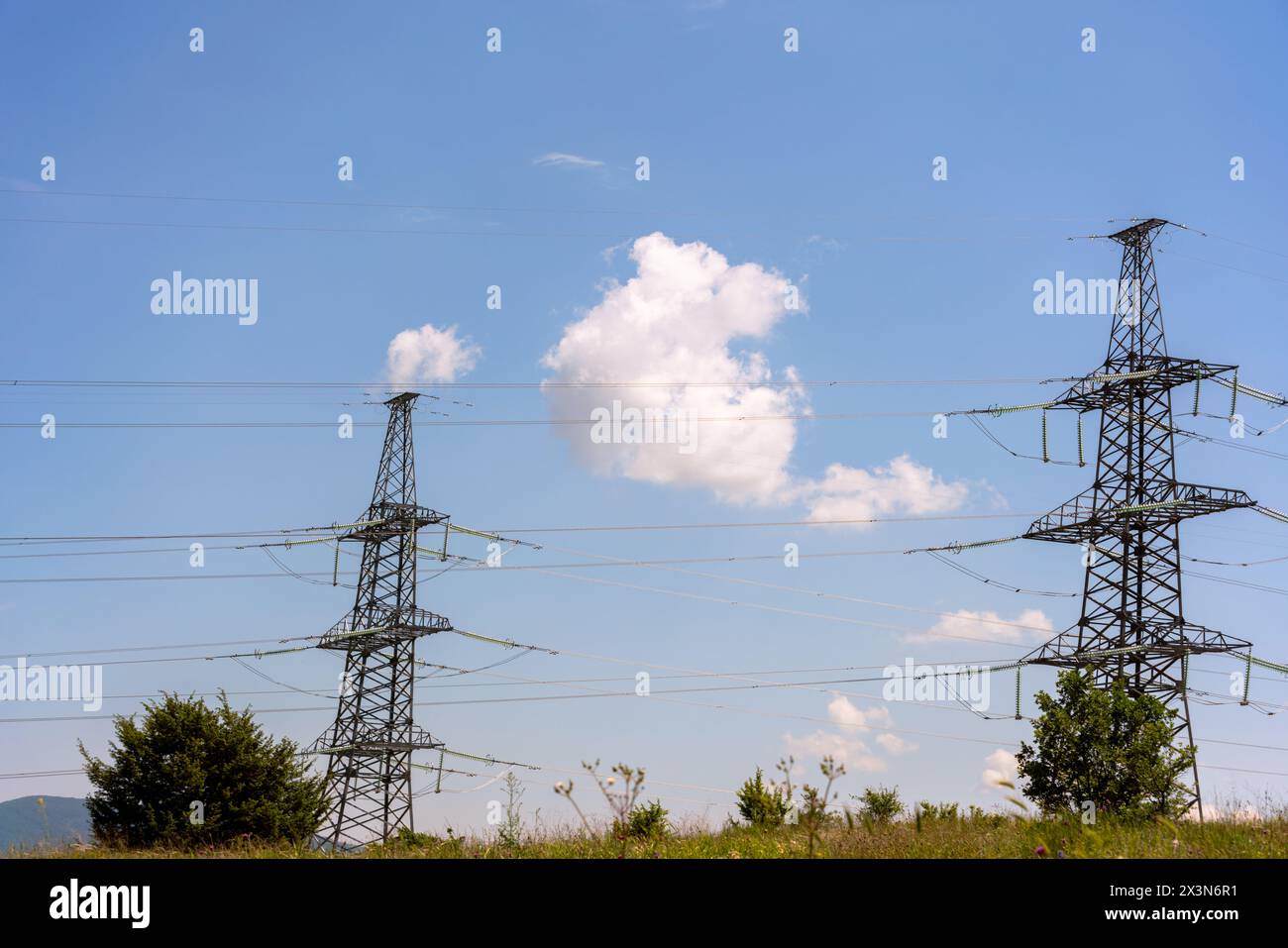 High voltage towers with sky background. Power line support with wires ...