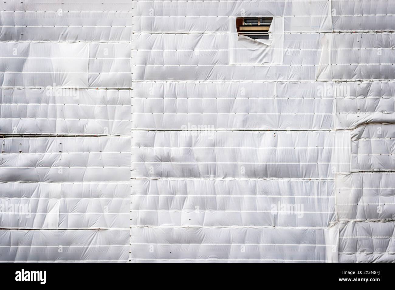 Flame retardant scaffold sheeting wrapped apartments building during ...