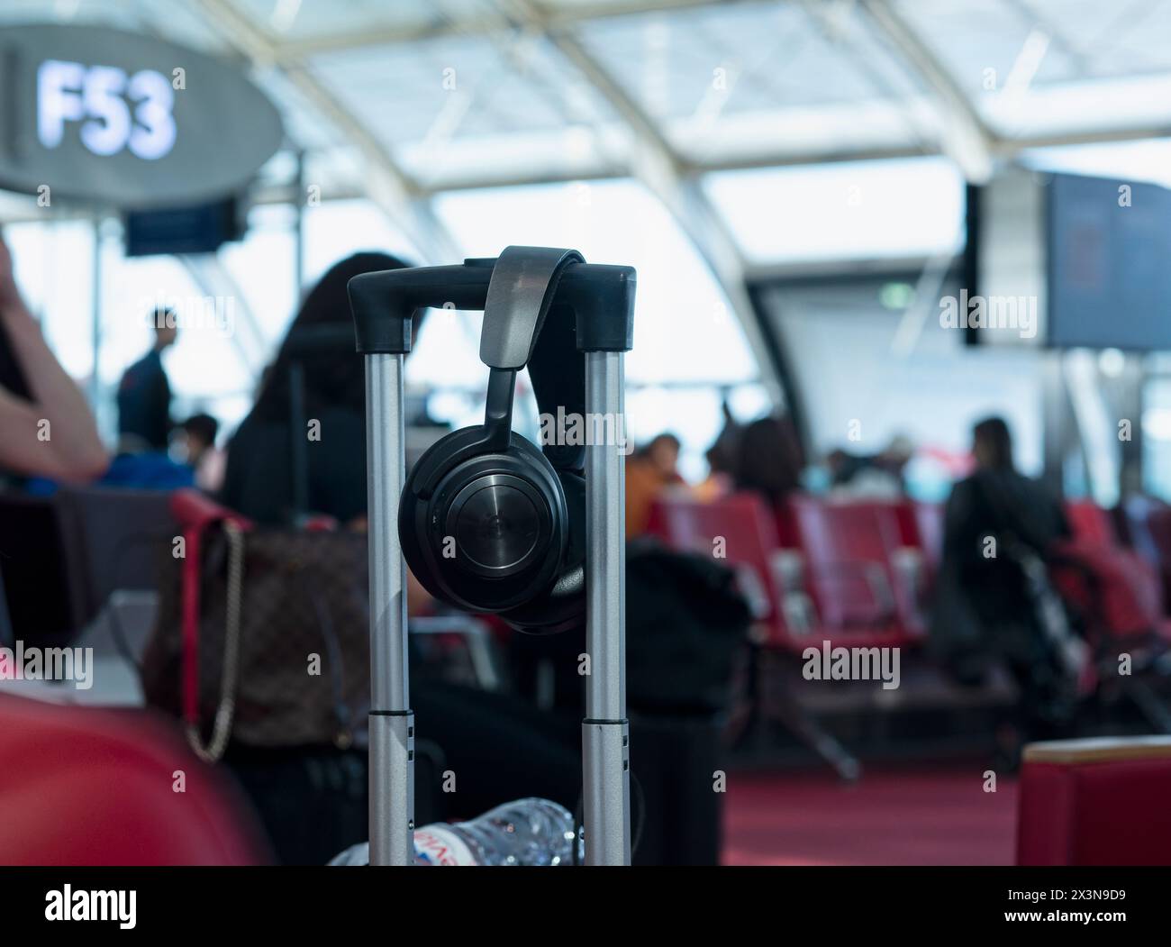 Close-up of hi-fi headphones resting in a trolley in the waiting area ...