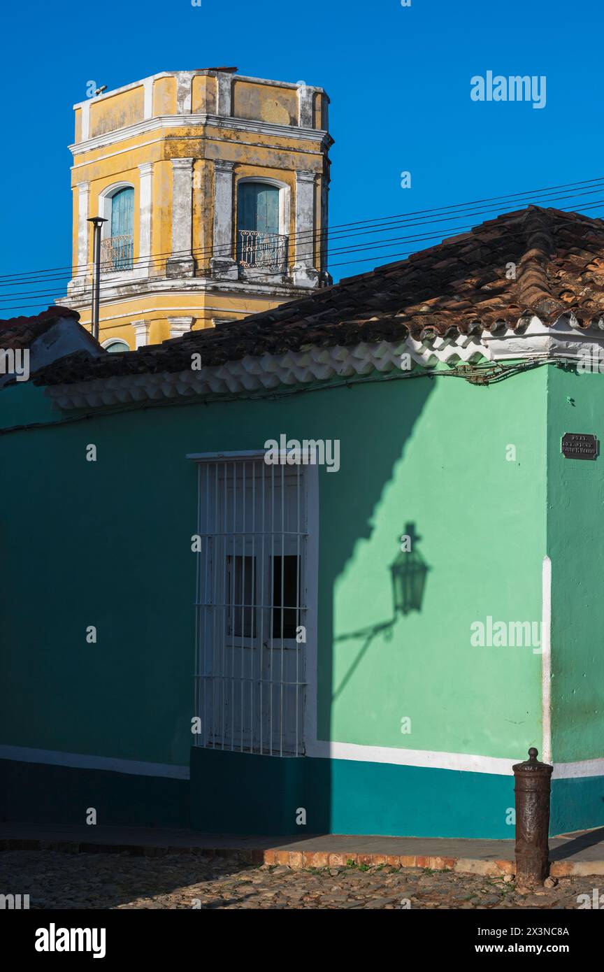 Shadows and patterns created by a street light and passing people on a ...