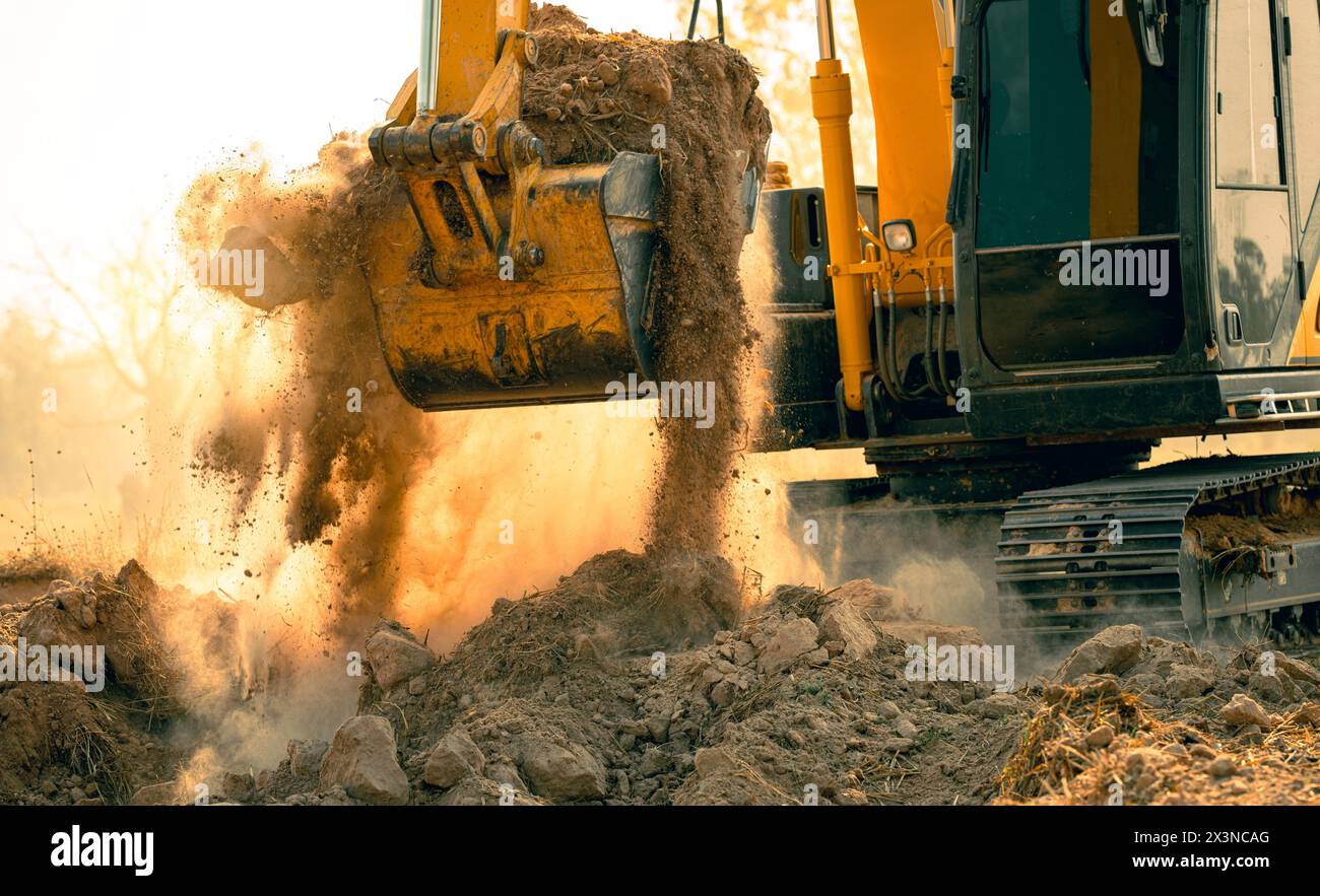 Close-up of excavator at construction site. Backhoe digging soil for ...