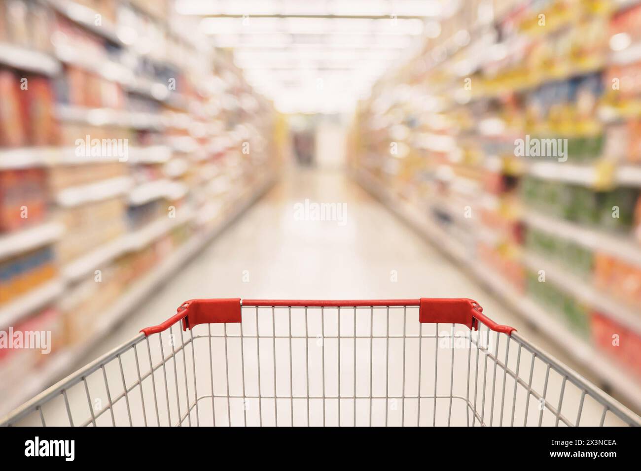 Abstract Supermarket aisle with empty shopping cart Stock Photo - Alamy
