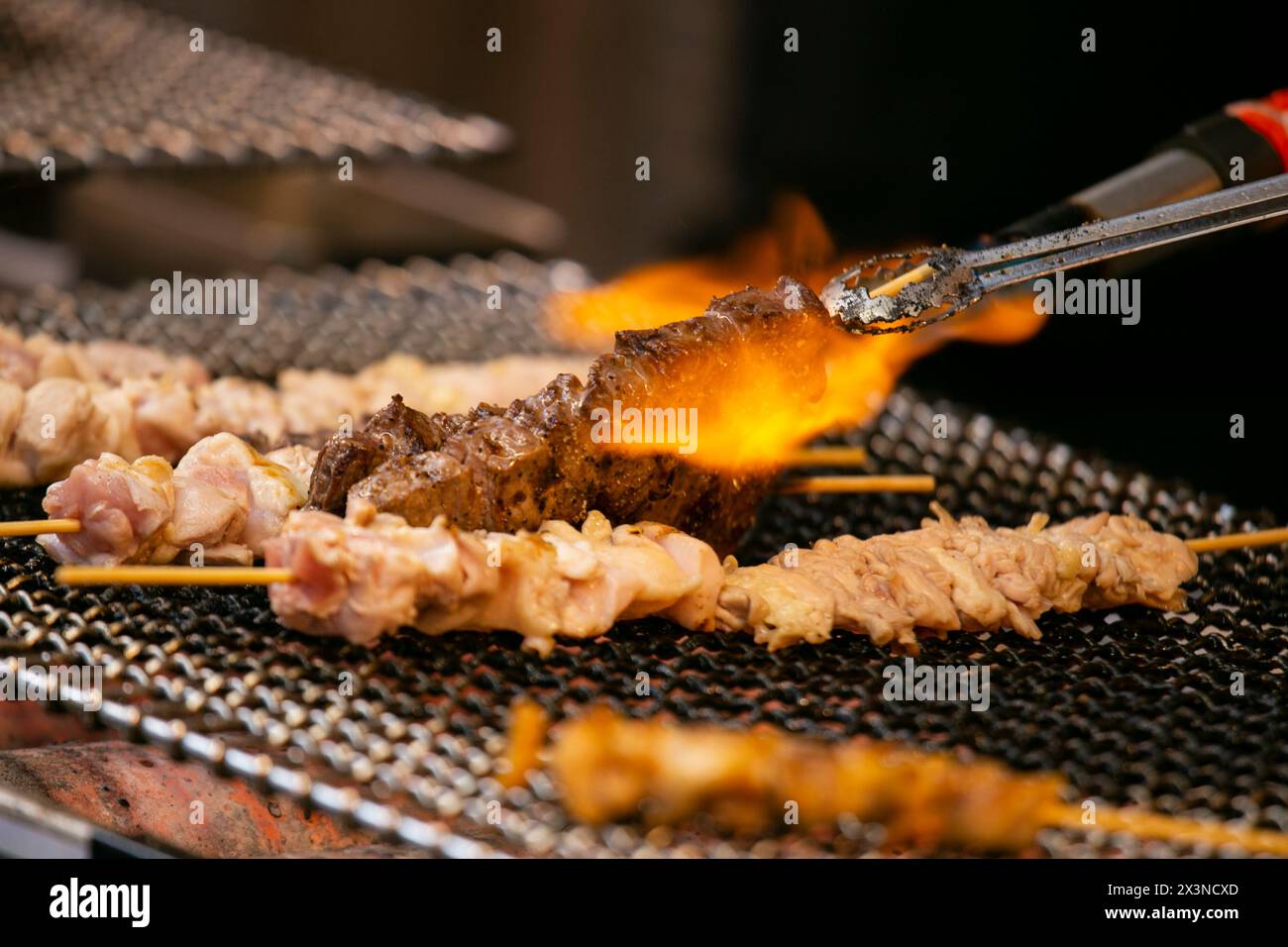 Grilled yakitori chicken skewers at an Izakaya restaurant in Omoide ...