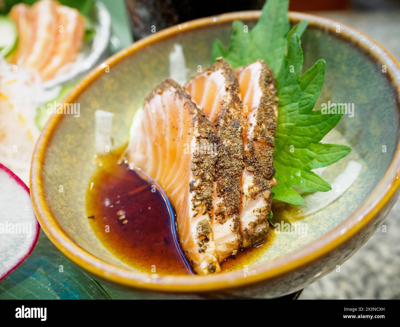 fresh salmon slice sashimi on oba leaf Japanese style Stock Photo - Alamy