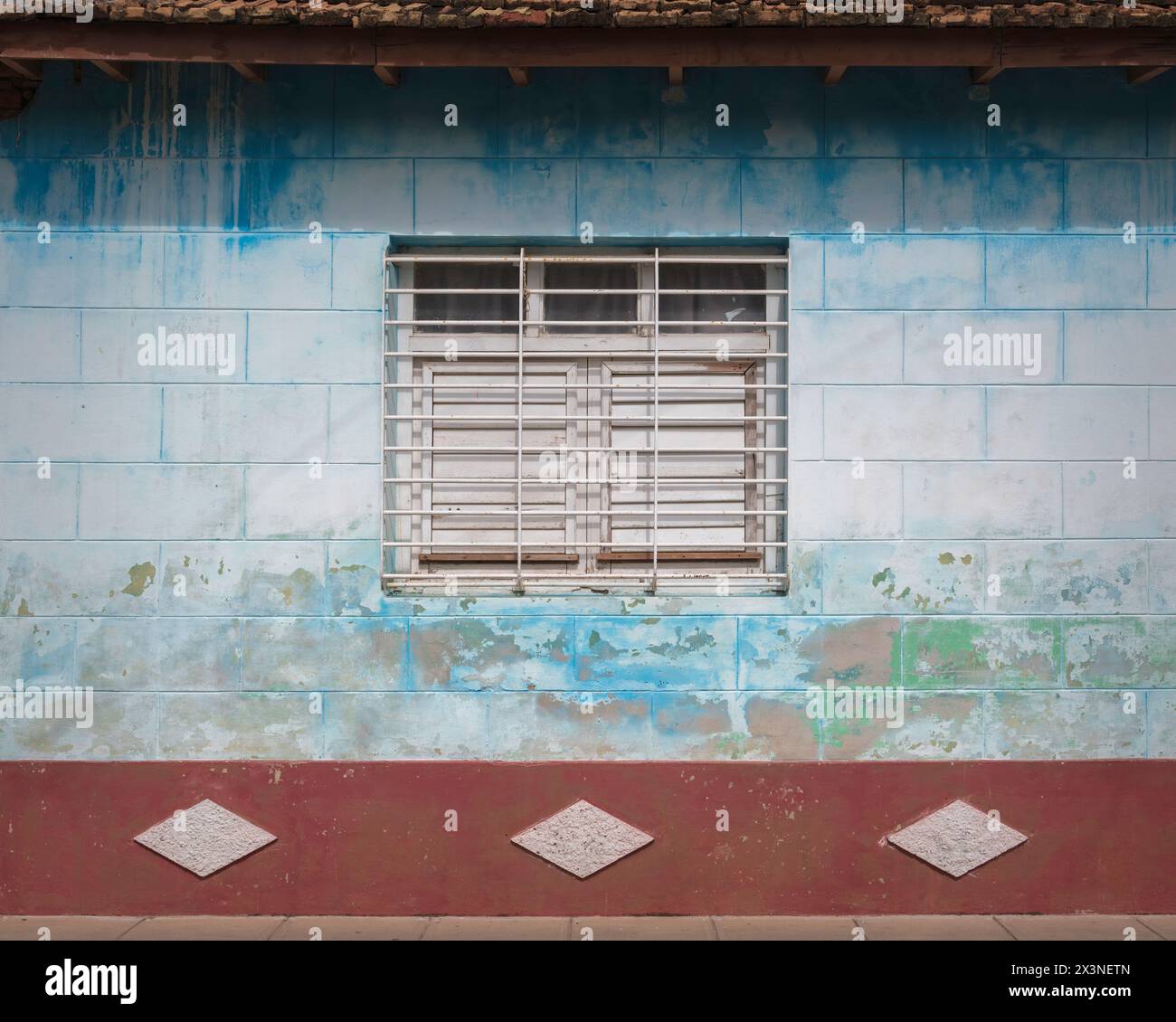 Metal grilles over windows of older houses in the backstreets of ...
