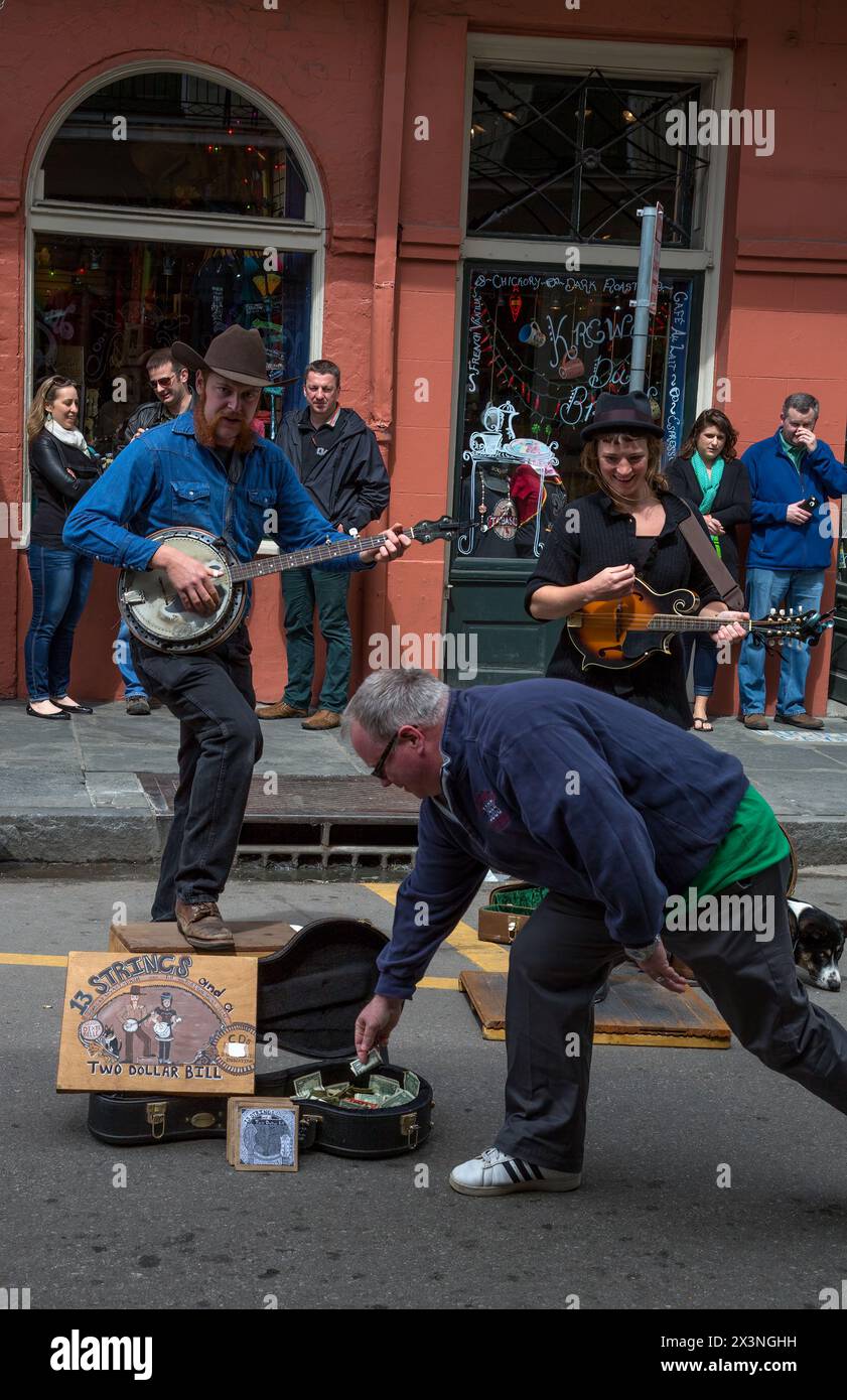 French Quarter, New Orleans, Louisiana. Making a Donation to Street ...