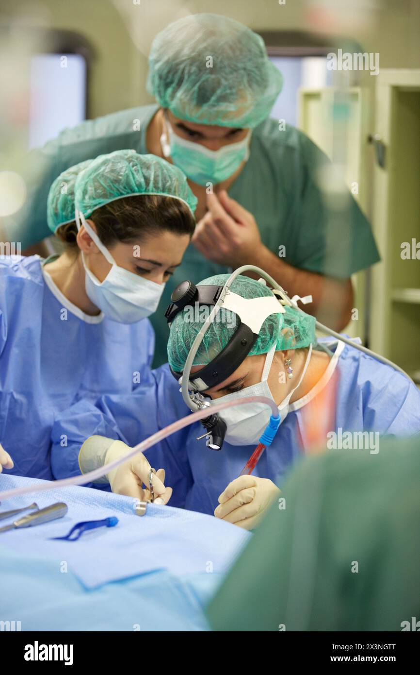 Tonsillectomy, Surgeons performing a tonsillectomy tonsil removal ...