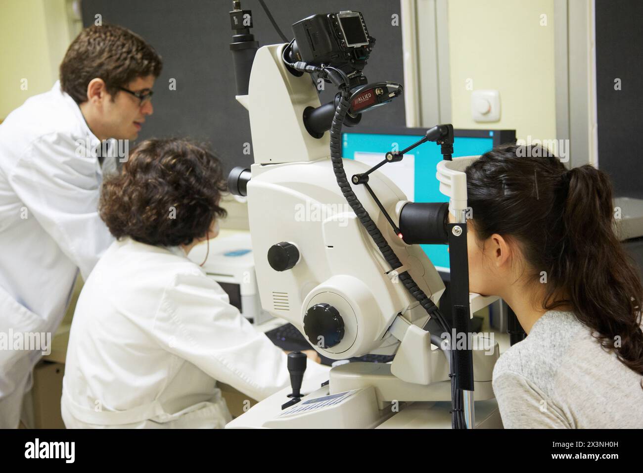 Eye examination Doctor using a retinal camera during an angiography ...