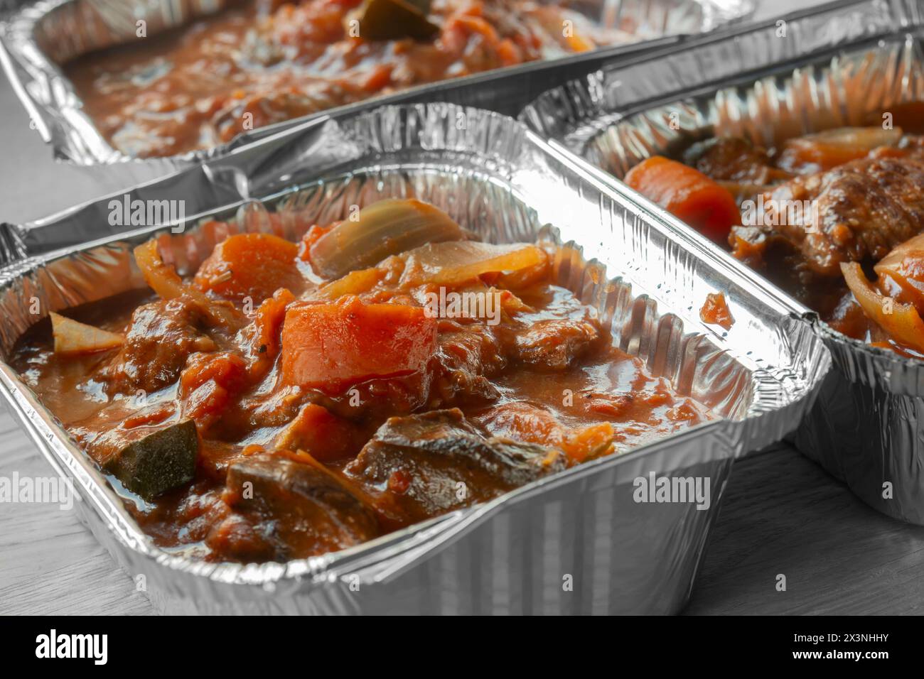Beef casserole, with herbs and vegetables, in a red wine and tomato sauce. In foil trays. Batch ...