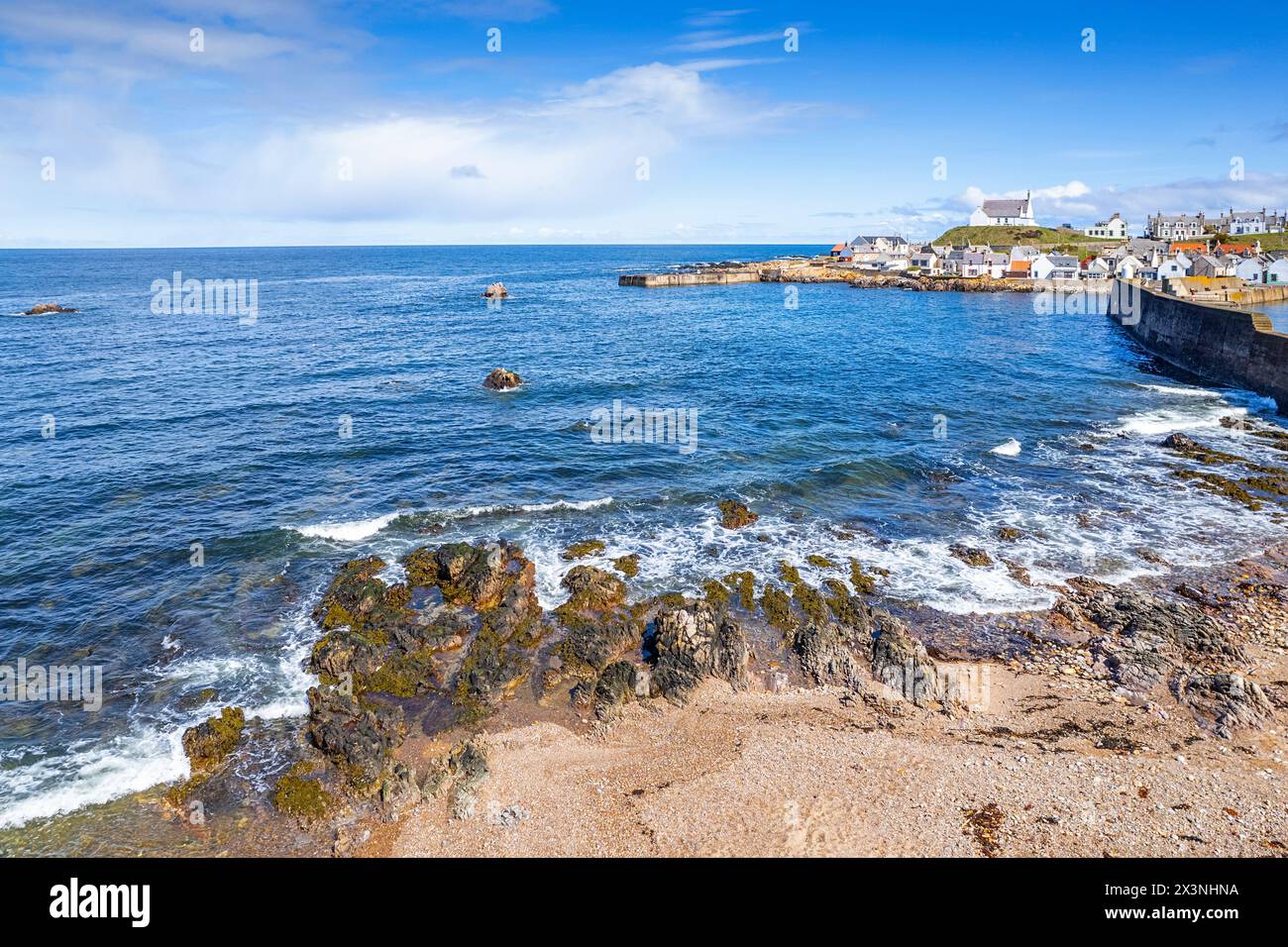 Findochty Moray Firth Scotland a blue sky over the white church on a ...