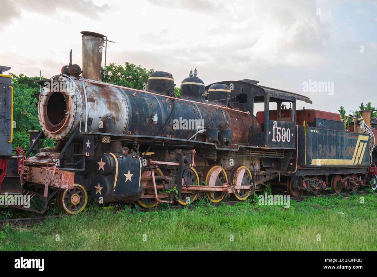 The partly dismantled, rusting remains of vintage steam engines lined ...