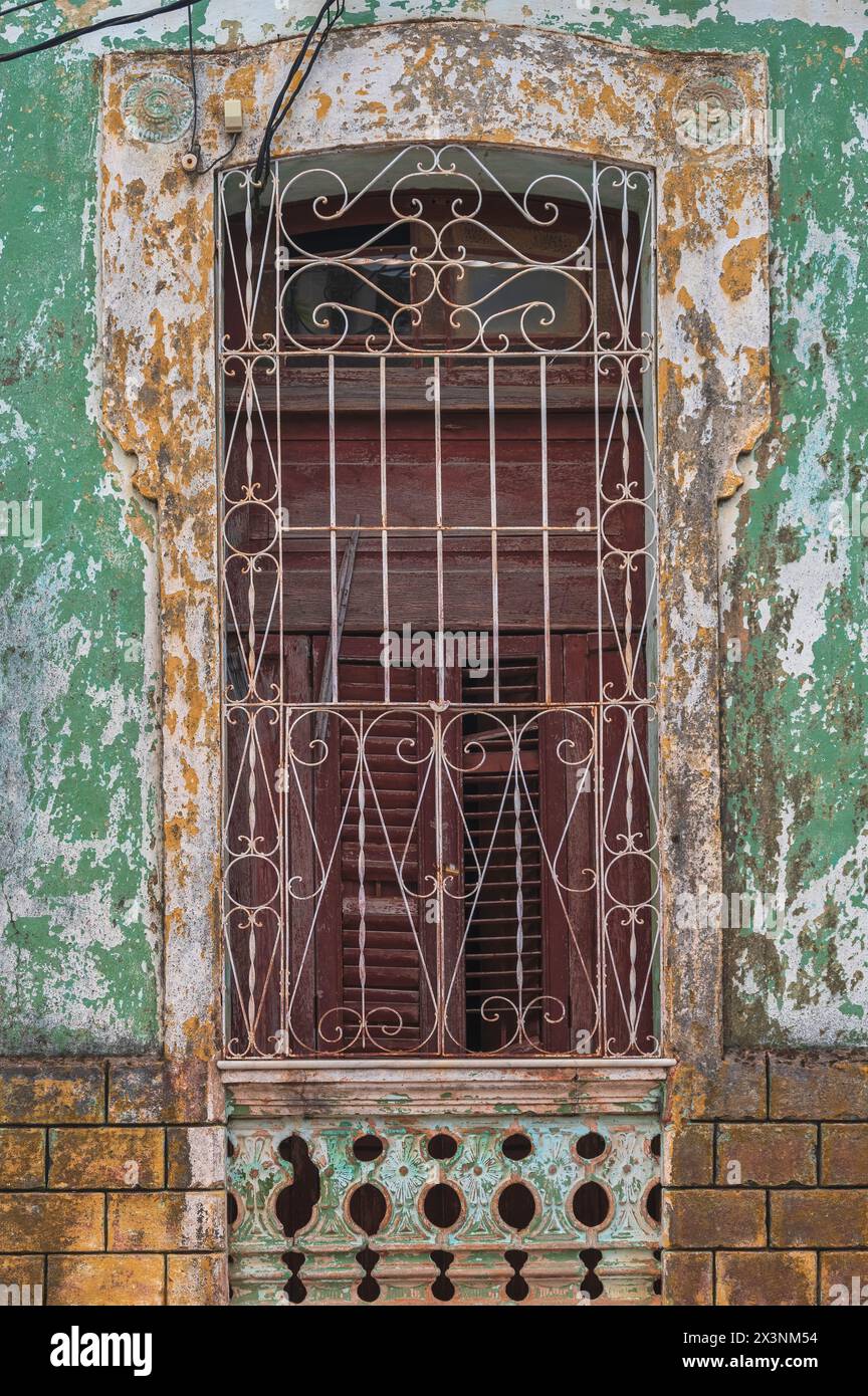 Metal grilles over windows of older houses in the backstreets of ...