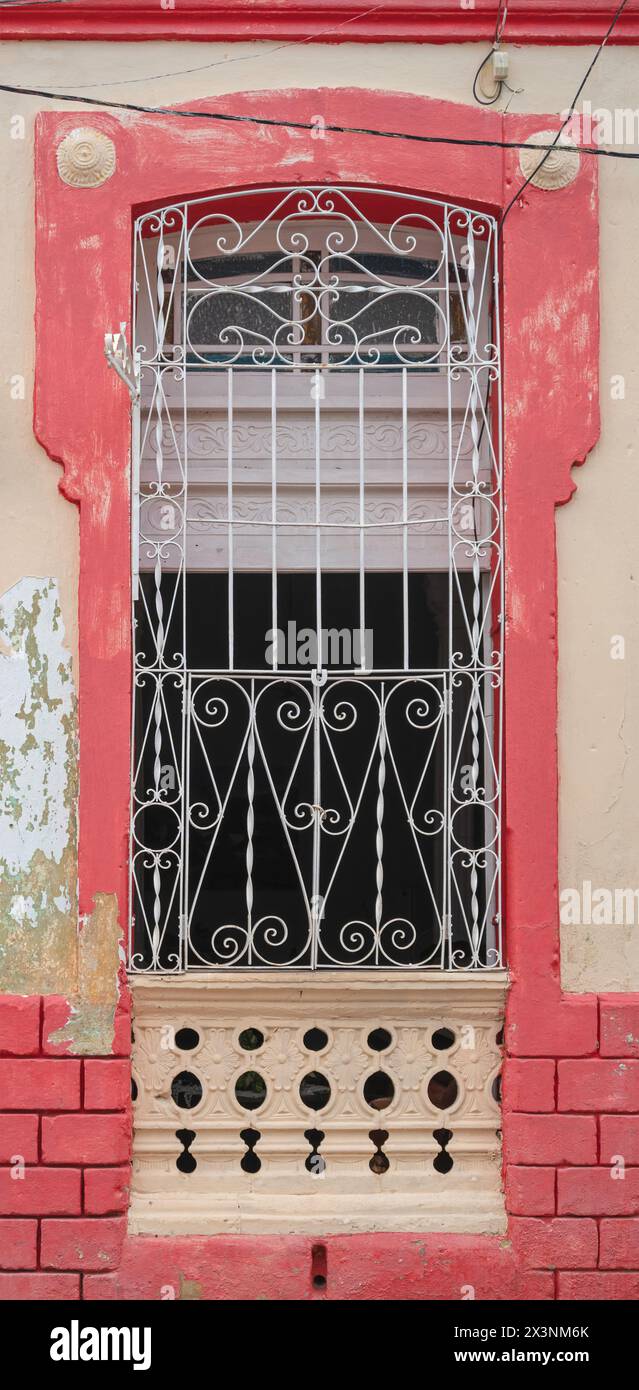 Metal grilles over windows of older houses in the backstreets of ...