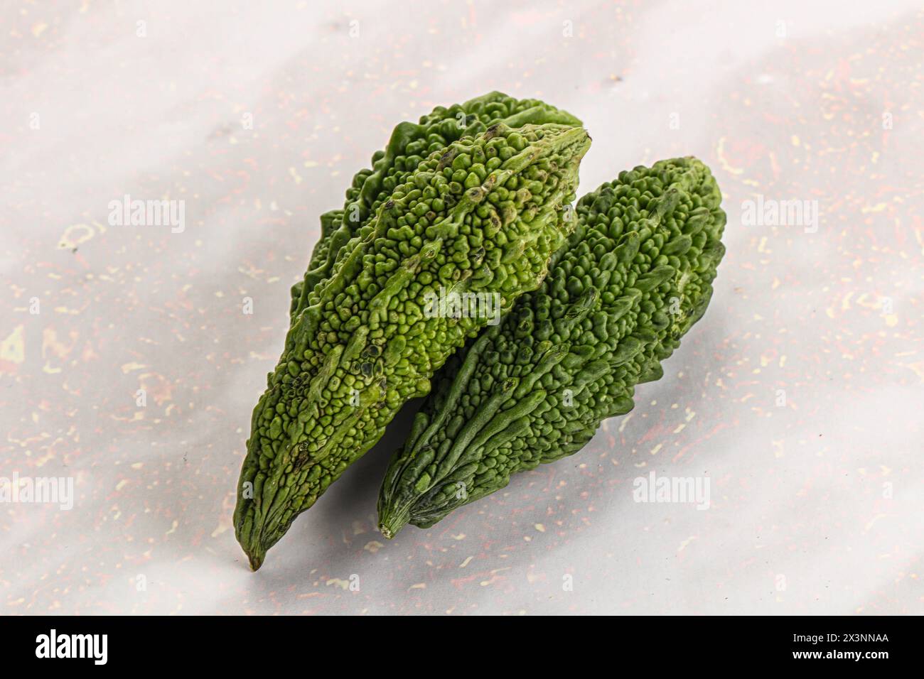 Green raw bitter lemon vegetables heap Stock Photo - Alamy