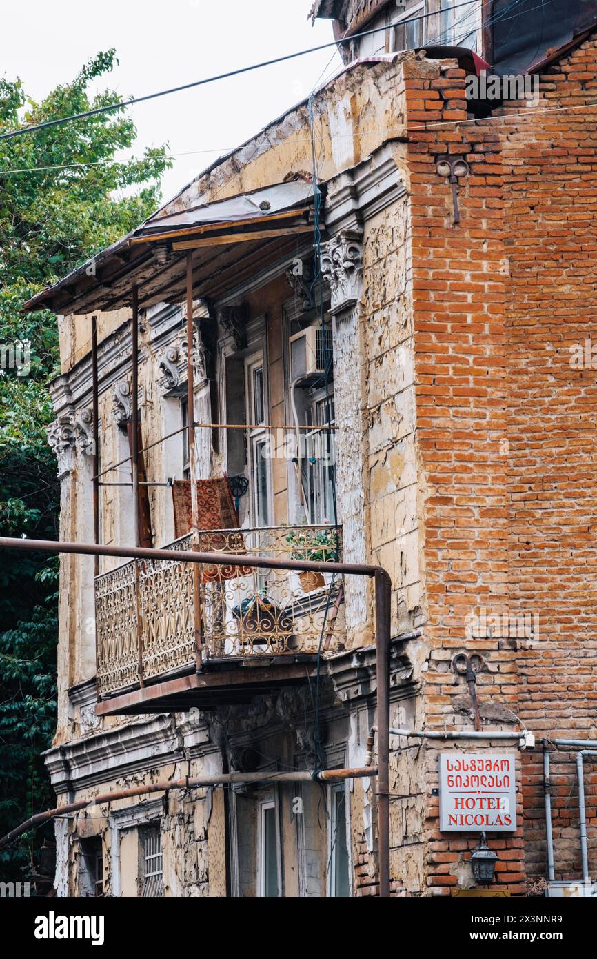 Typical dilapidated georgian house in Tbilisi old town (Georgia). The ...