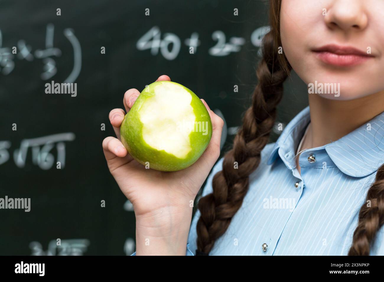 Sweet lesson: Girl with an apple - a symbol of health and education ...