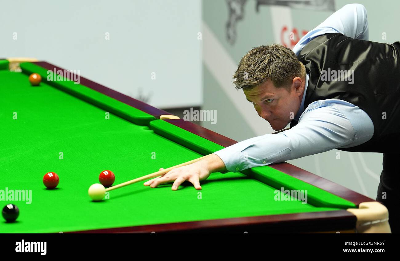 Ryan Day plays a shot during his match with Ronnie O'Sullivan, on day ...