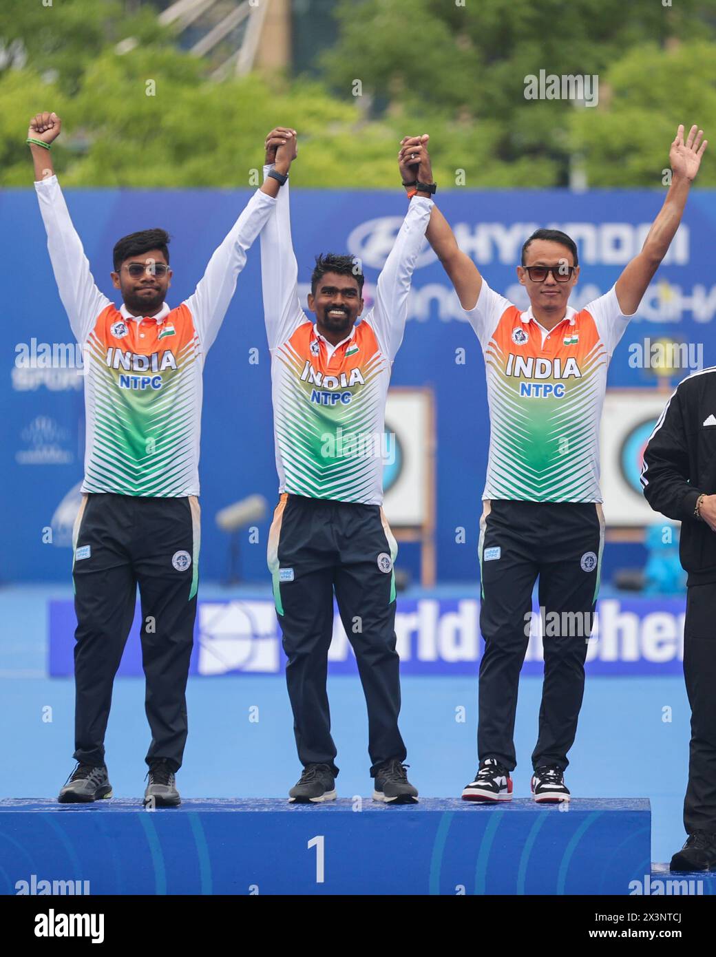 Shanghai, China. 28th Apr, 2024. Gold medalists Dhiraj Bommadevara (L ...