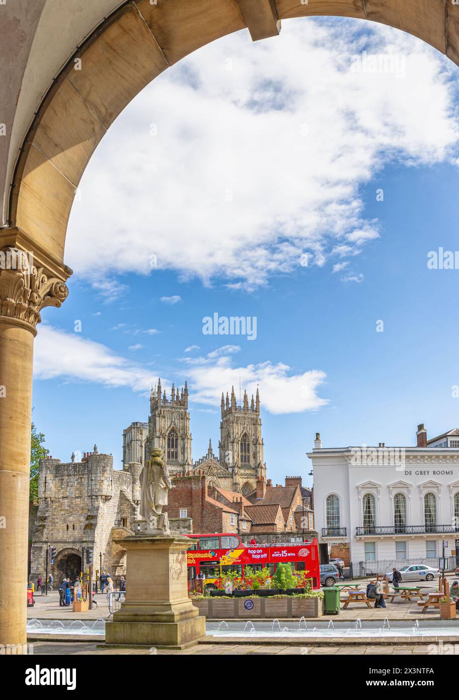 The west facing towers of York Minster framed by an arch and behind an ...