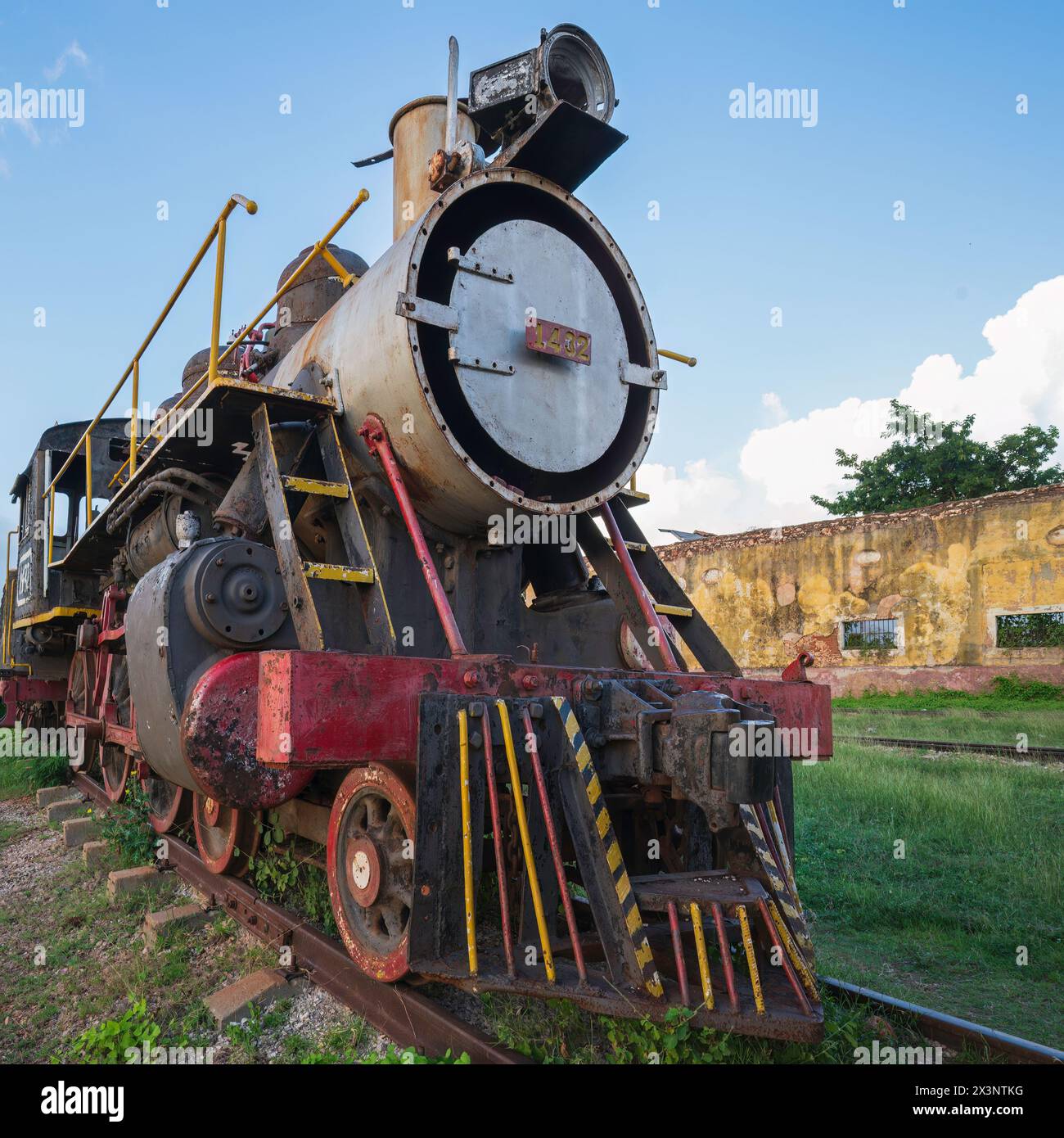The partly dismantled, rusting remains of vintage steam engines lined ...