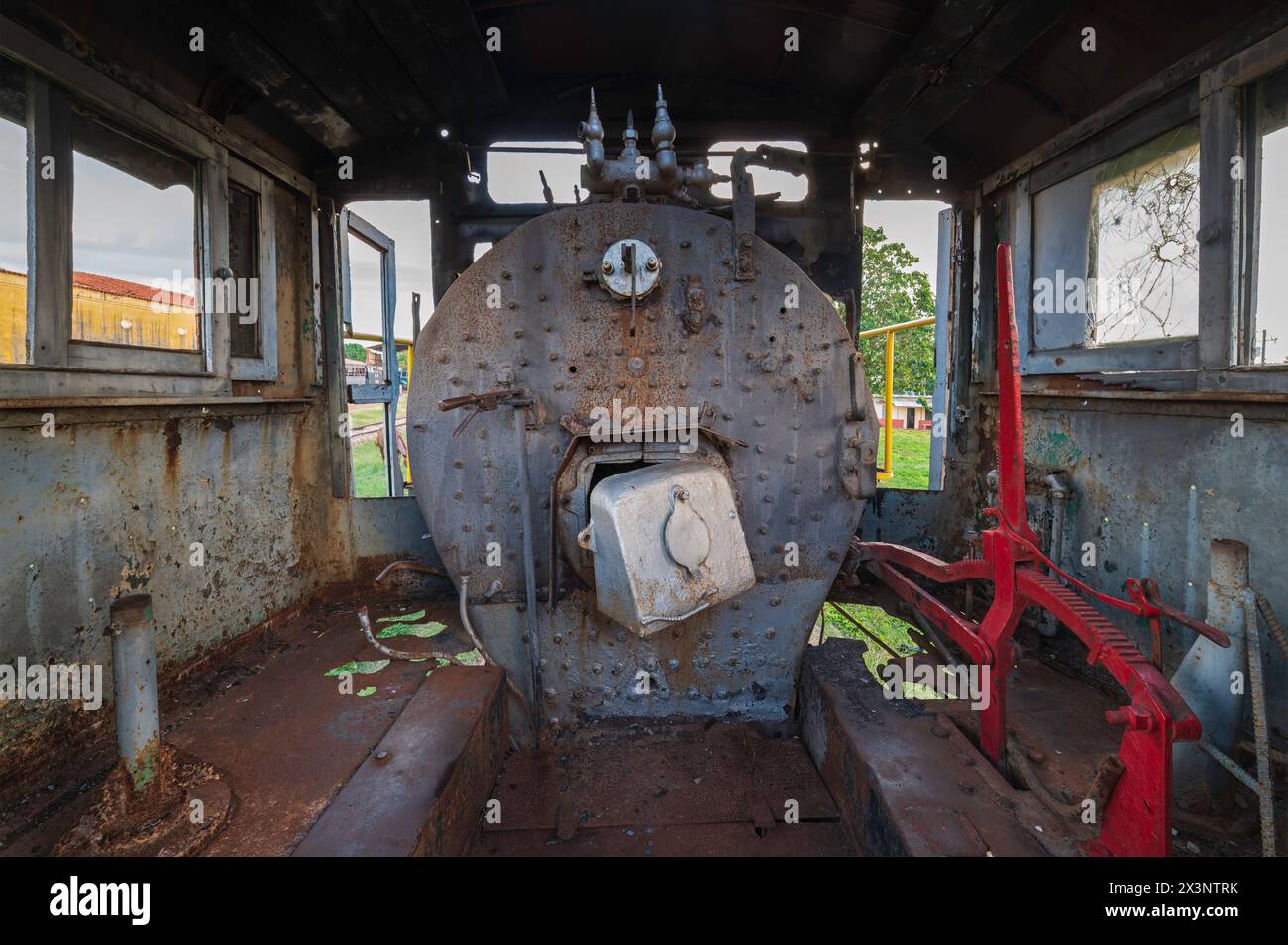 The partly dismantled, rusting remains of vintage steam engines lined ...