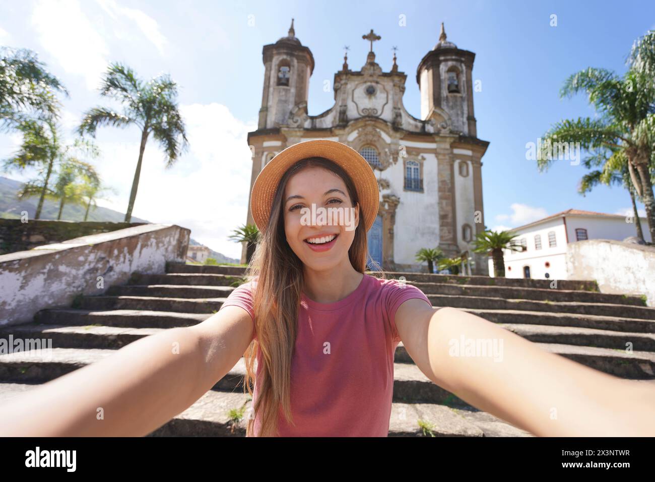 Beautiful tourist woman takes self portrait in the baroque colonial ...