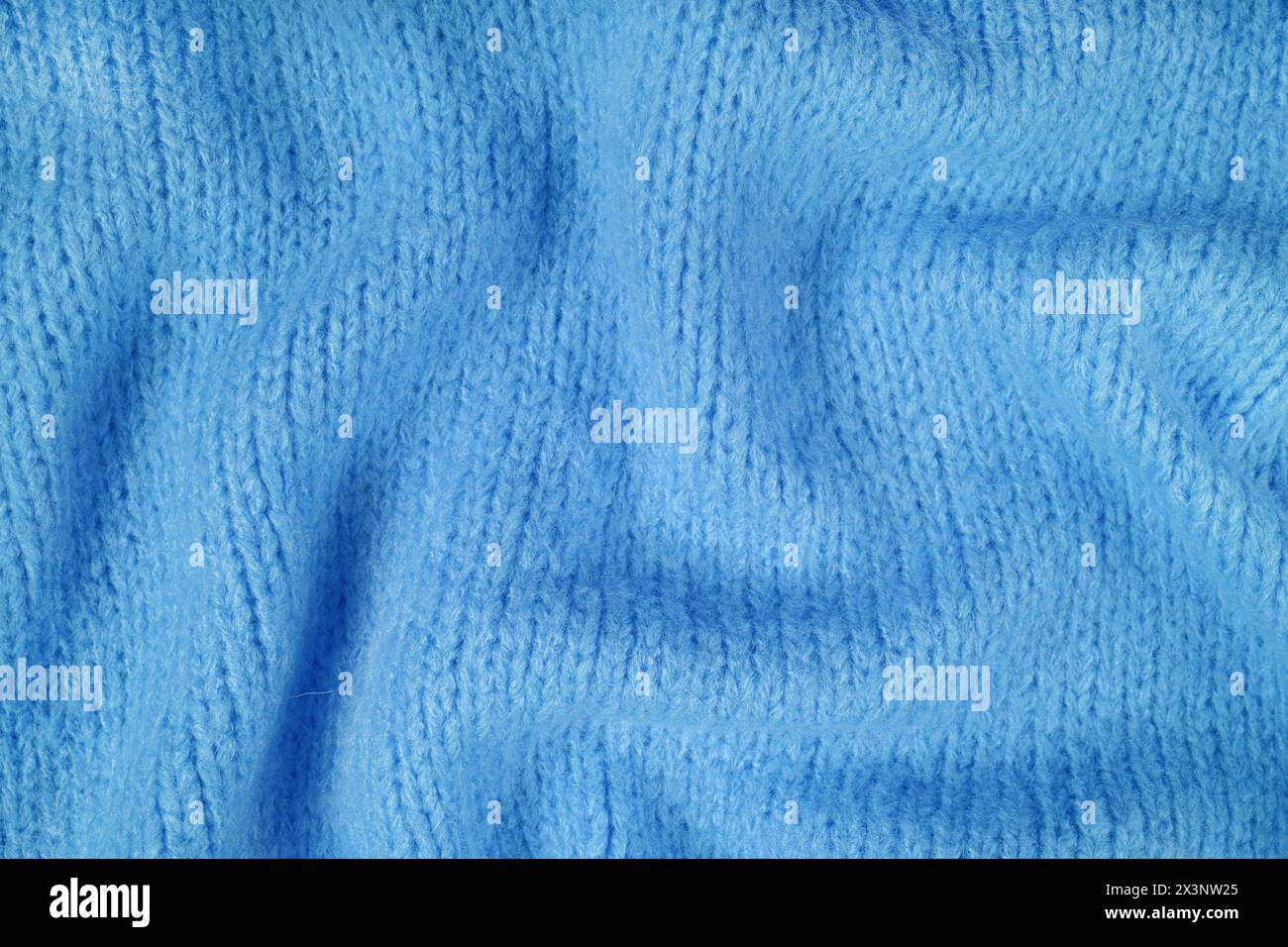 Close up background of blue knitted fabric made of viscose yarn ...