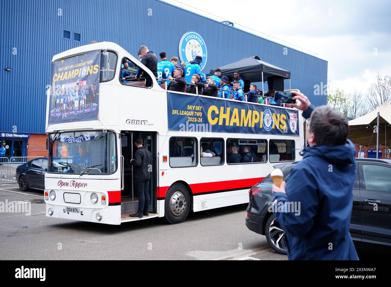 Stockport County players board an open-top bus outside Edgeley Park ...