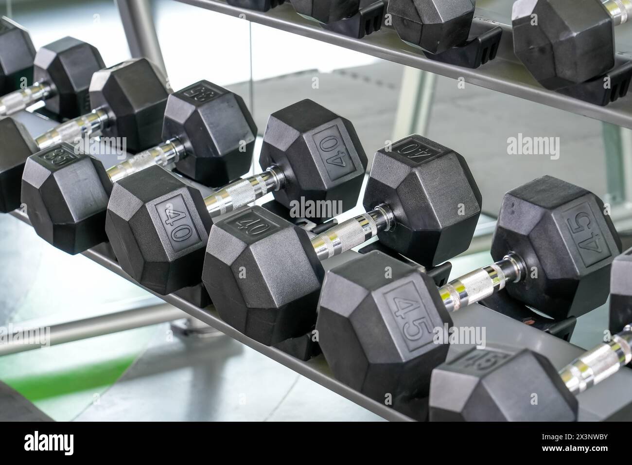 Rows of dumbbells weight in pounds in the gym of modern dumbbells equipment in the sport Stock ...