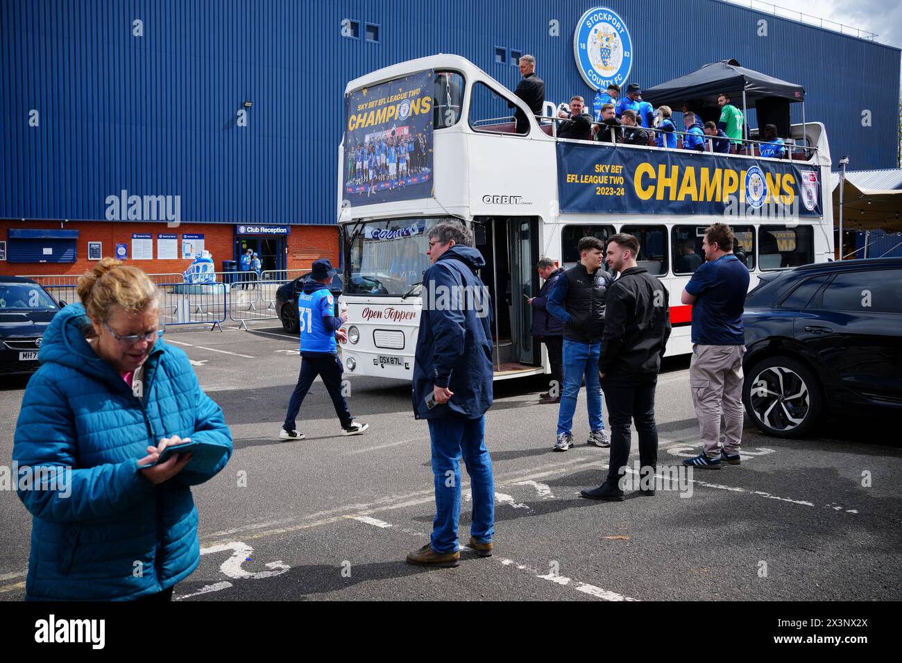 Stockport County players on an open-top bus outside Edgeley Park ...