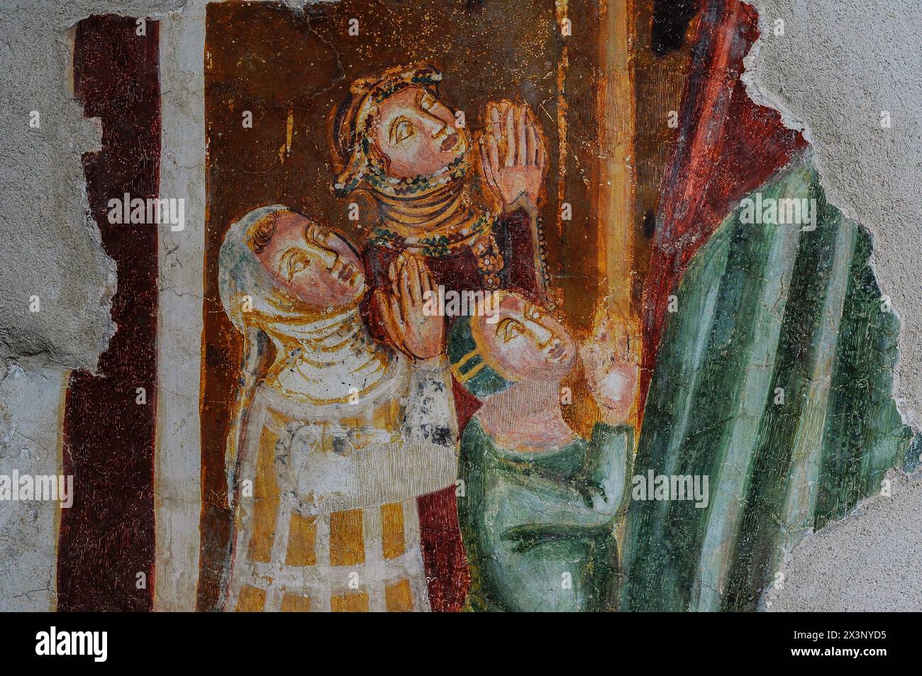 Three women with hands clasped in prayer in detail from fresco, painted ...