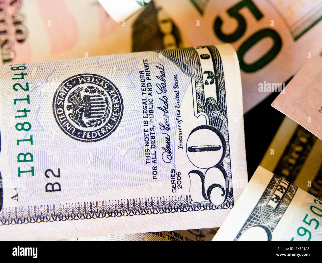 US Dollar Bills. Various denominations of US dollars, rolled and flat ...