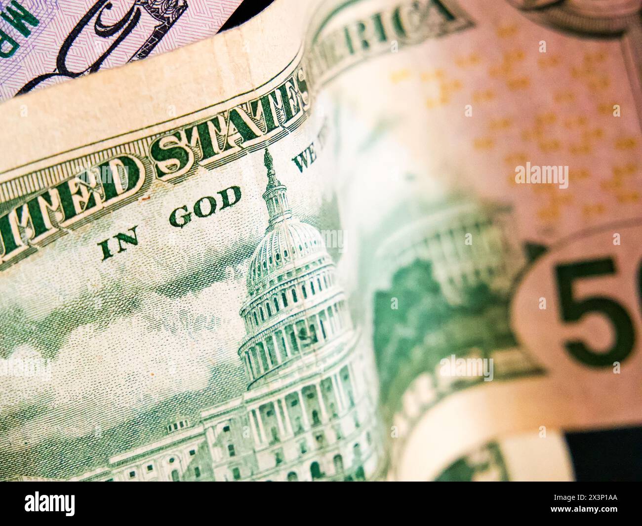 Financial Focus. Close-up of US dollars, Capitol building, and motto ...