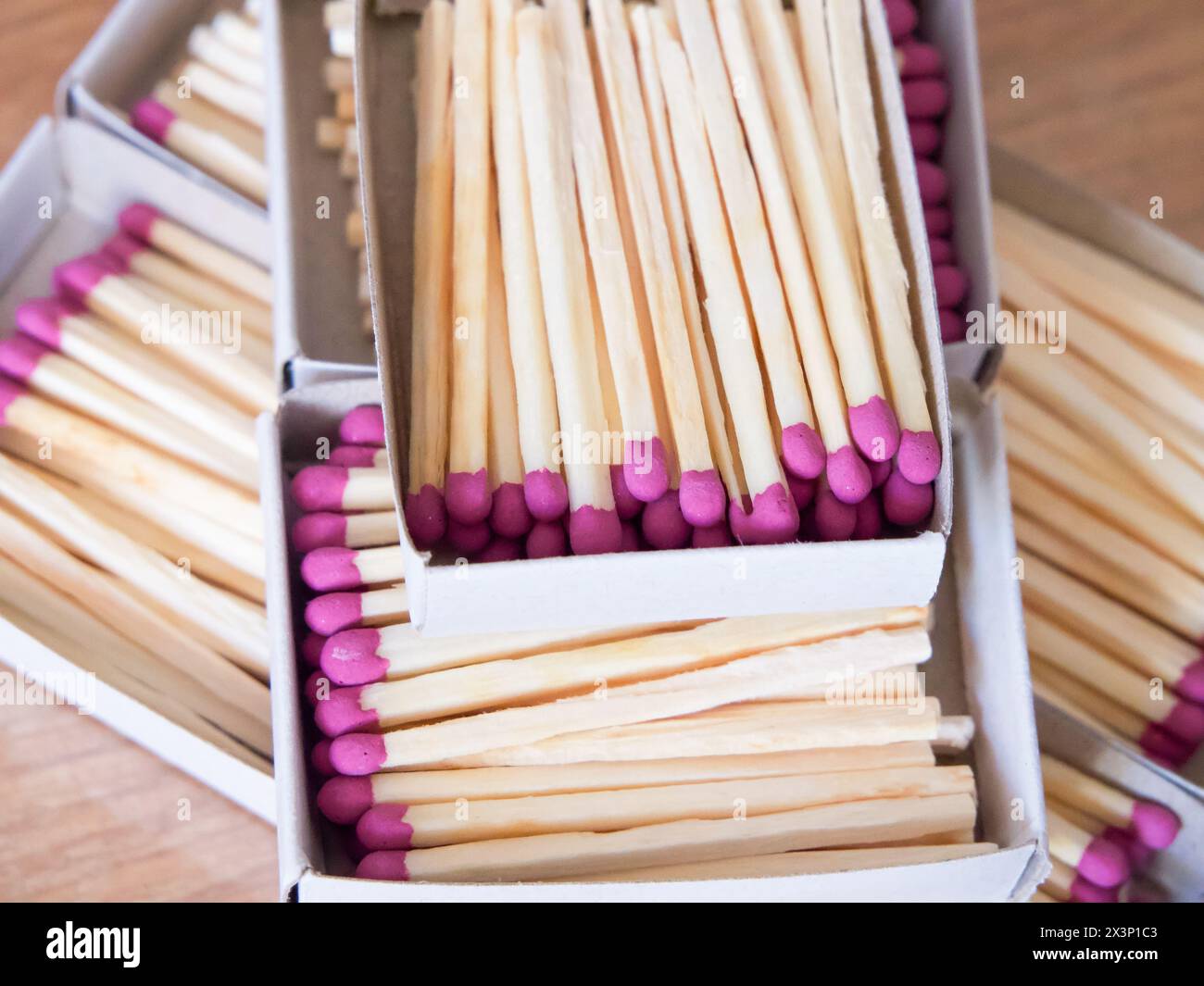 Ready-to-Strike Matches. Pink-tipped matches in boxes, symbolizing ...