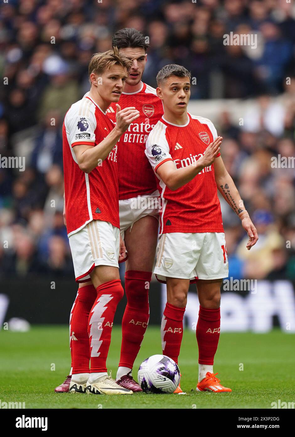 Left to right, Martin Odegaard, Declan Rice and Leandro Trossard line ...