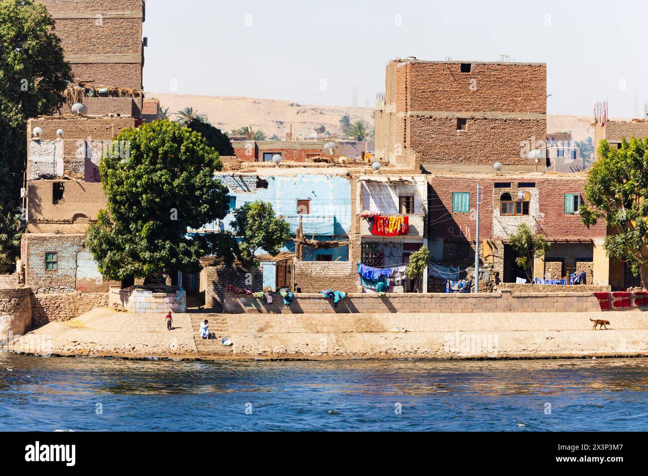 Colourful homes on the West bank of the River Nile, Aswan, Edfu, Egypt ...