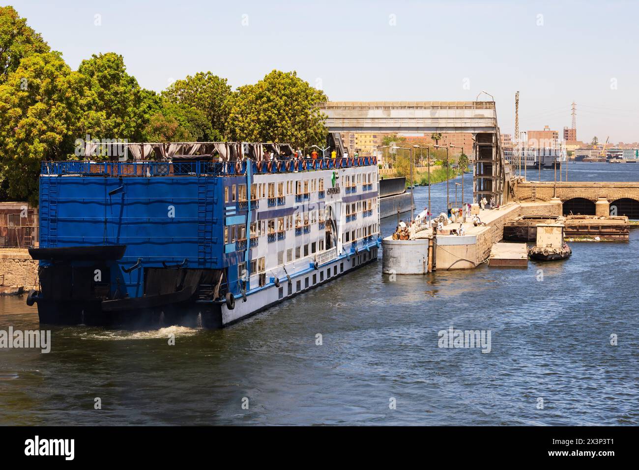 Nile cruise tourist ship enters the Old barrage bridge lock at Esna on ...