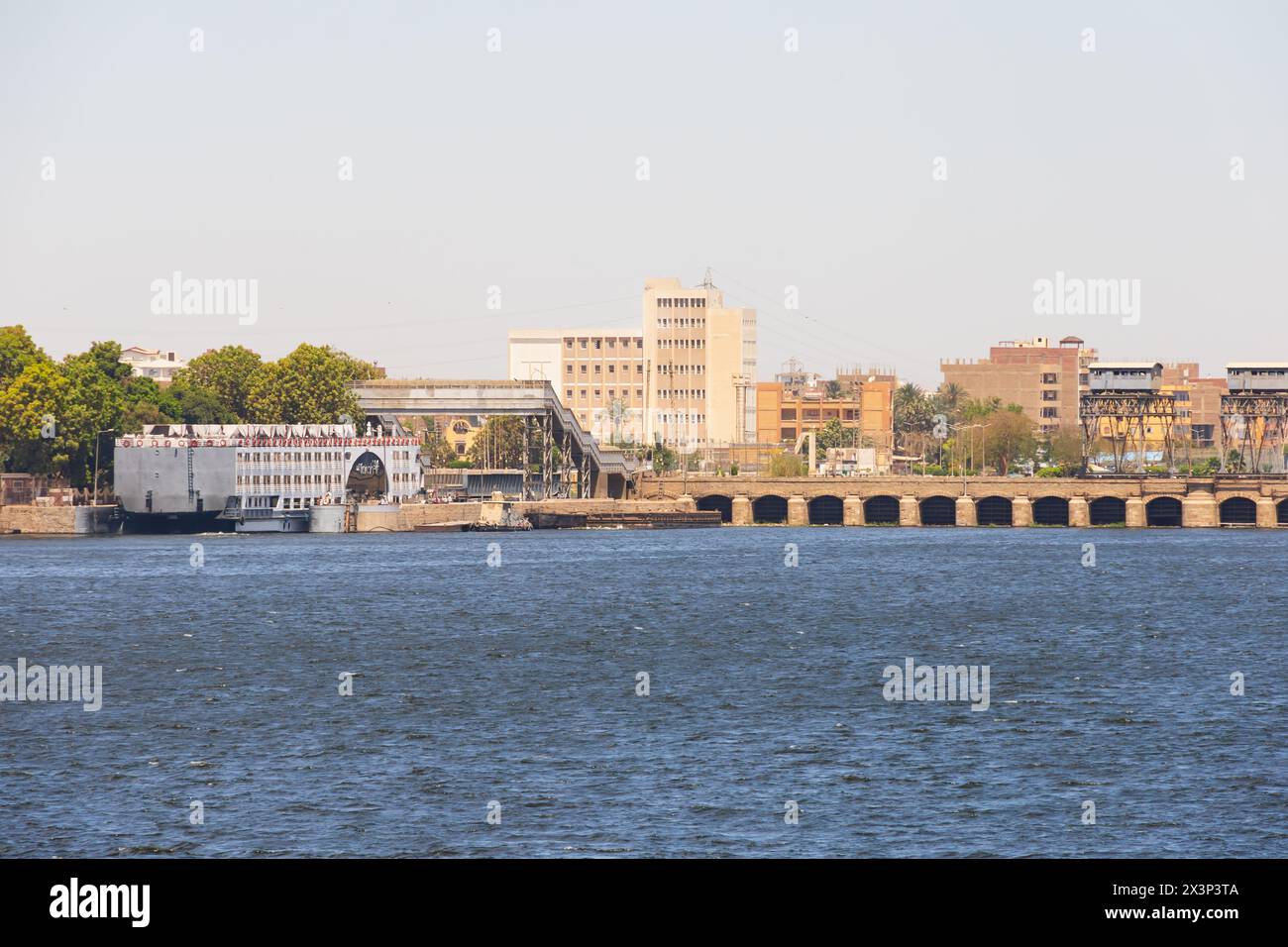 Nile cruise tourist ship enters the Old barrage bridge lock at Esna on ...